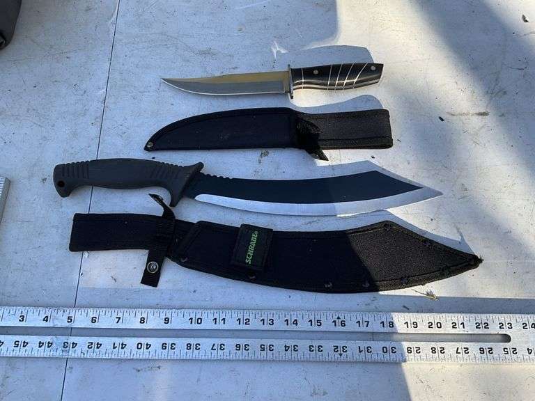 2 knives with sheaths. Larger one is Schrade - Legacy Auction Company