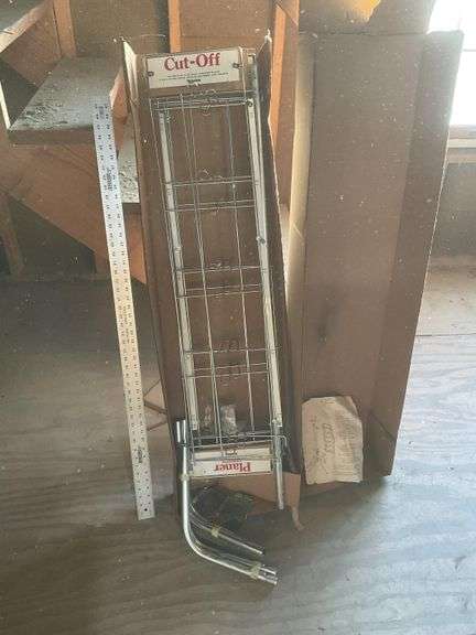 Nicholson circle saw carousel stand , NIB - Legacy Auction Company