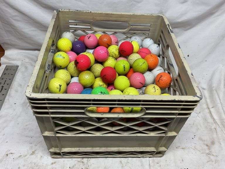 Golf balls and milk crate - Legacy Auction Company