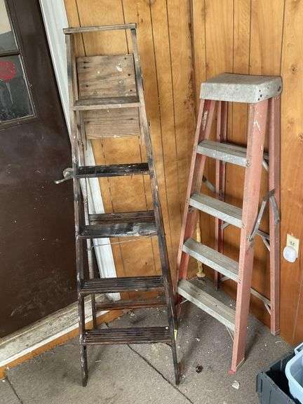 Fiberglass and wooden step ladders, some damage - Legacy Auction Company