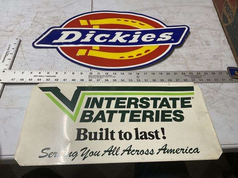 Dickies and interstate batteries tin signs - Legacy Auction Company