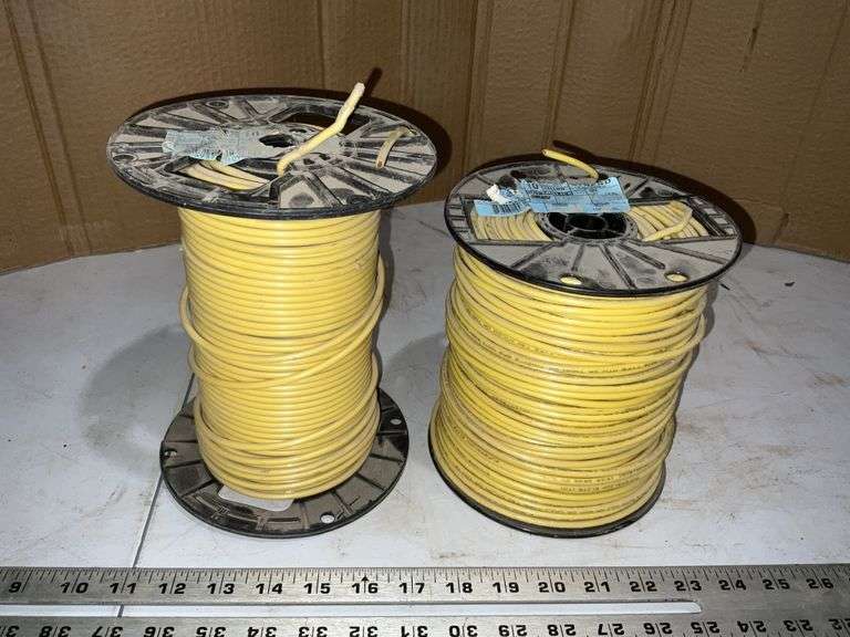 2 partial rolls of 10 strand yellow wire - Legacy Auction Company