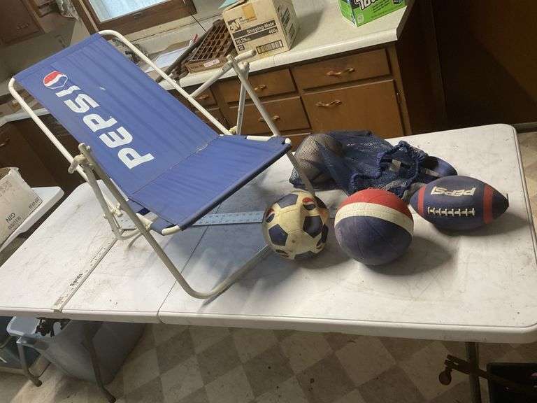 Pepsi beach chair and assorted Pepsi balls - Legacy Auction Company