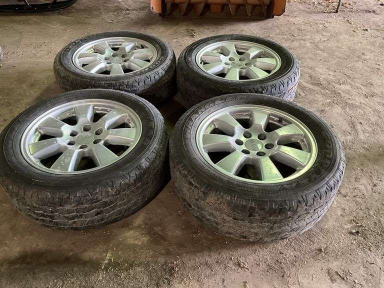Set of GMC 6-bolt rims and tires, 275/55/R20 - Legacy Auction Company