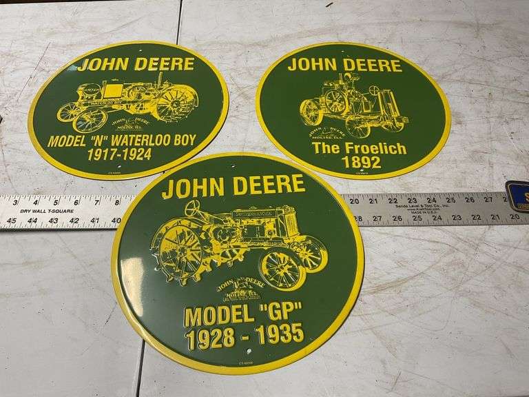 John Deere tractor signs - Legacy Auction Company