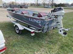 1990 Lund Rebel Special 16’ boat w/ Shorelander - Legacy Auction Company
