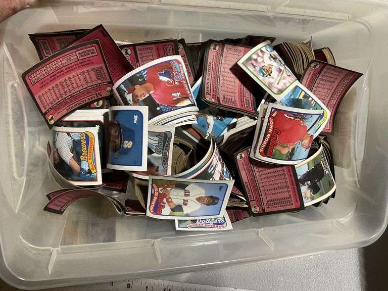 Tote and box with damaged baseball cards - Legacy Auction Company