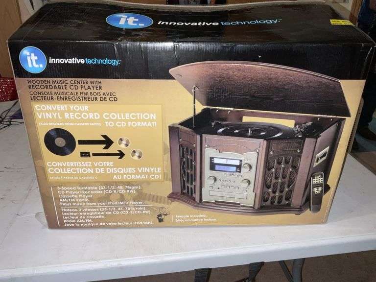Wooden music center with recordable CD player. - Legacy Auction Company
