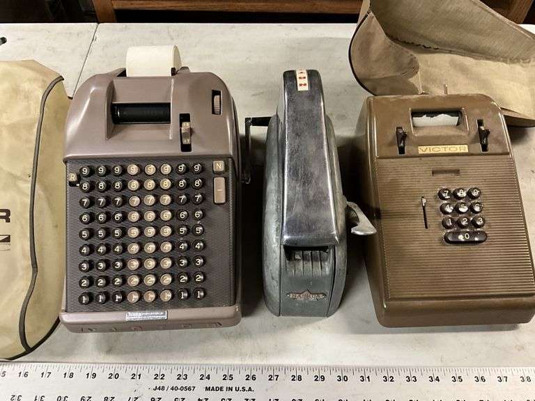 Vintage adding machines, tape dispenser - Legacy Auction Company