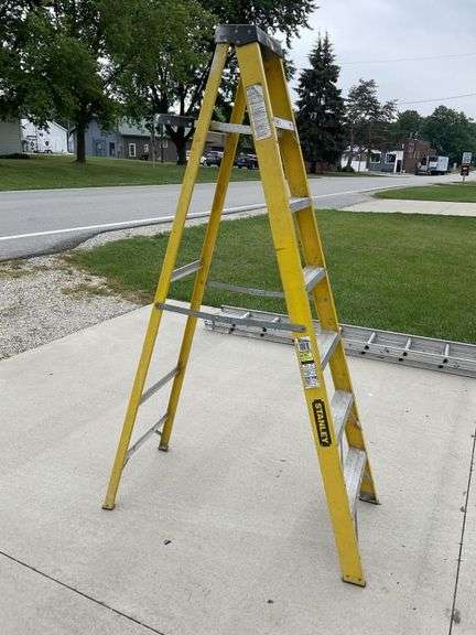 Stanley 7’ fiberglass step ladder - Legacy Auction Company