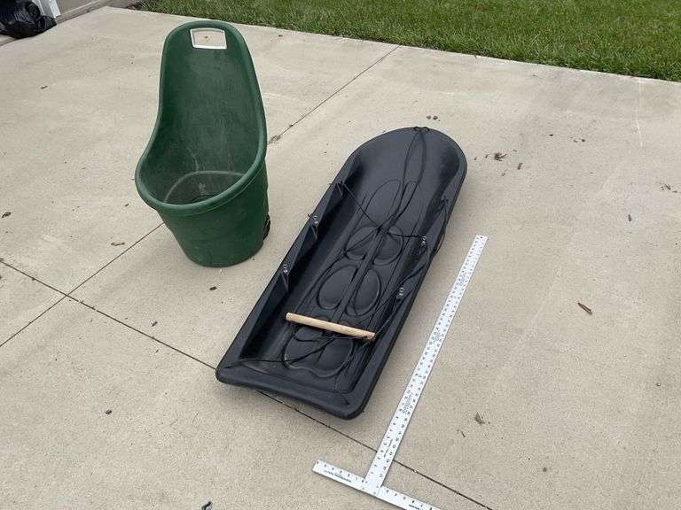 Plastic sled and plastic lawn cart on wheels - Legacy Auction Company