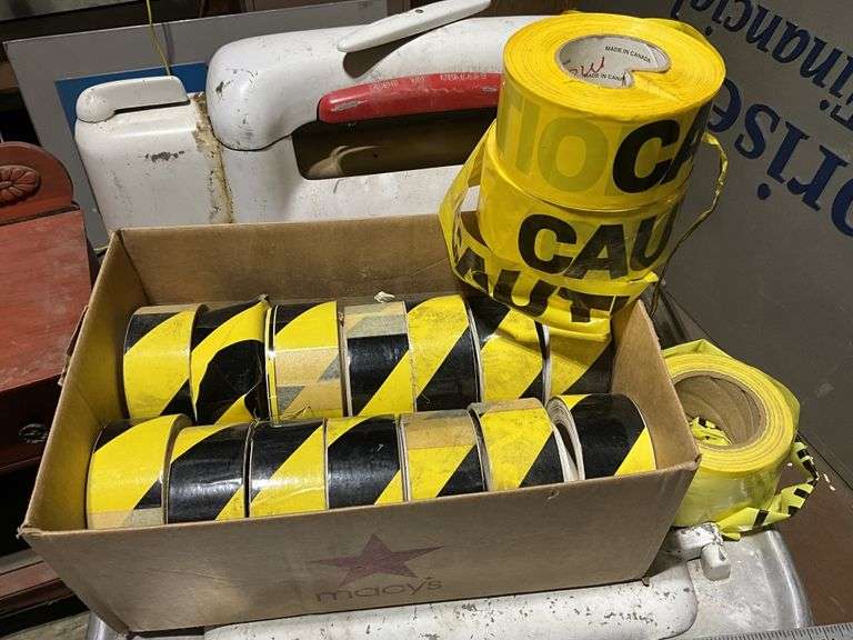 Rolls of caution tape & reflective stickers - Legacy Auction Company