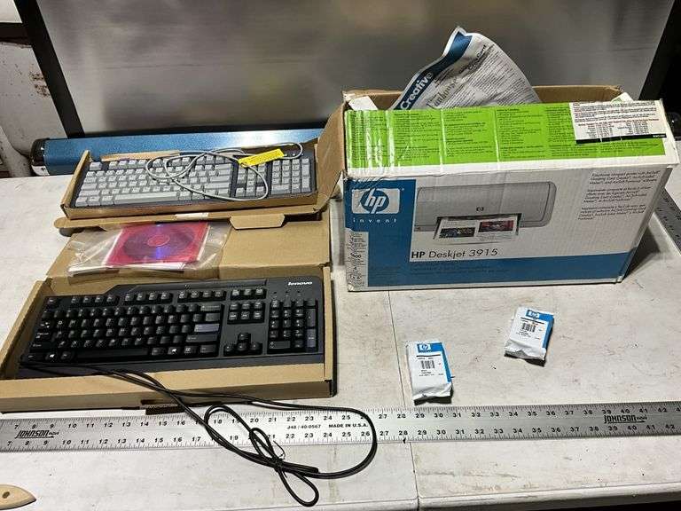 New computer keyboards, HP printer - Legacy Auction Company
