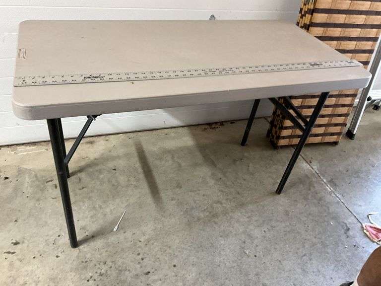 4’ folding table - Legacy Auction Company