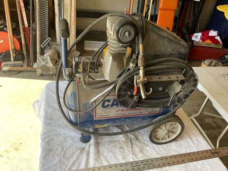 Cast Air air compressor - Legacy Auction Company