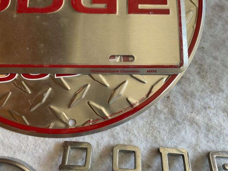 Dodge metal signs, emblems, etc. - Legacy Auction Company