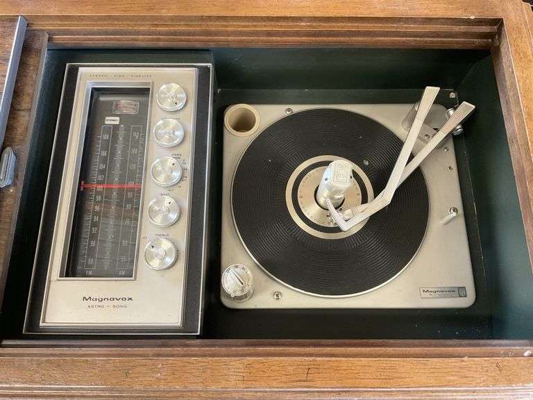Magnavox Console stereo system with records, on - Legacy Auction Company