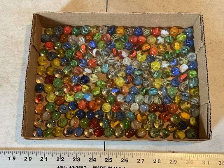 1- box of marbles - Legacy Auction Company