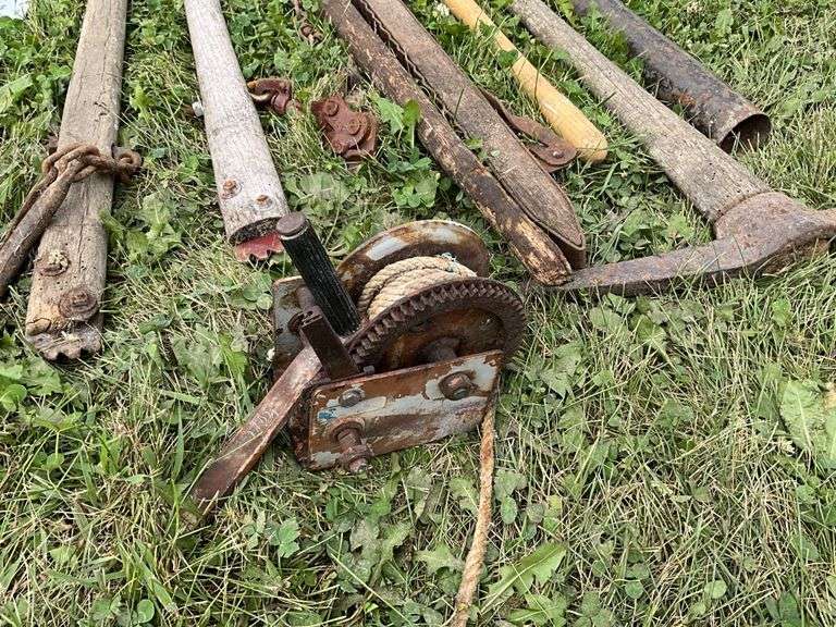 Post pounder, pickaxe, fence stretchers, winch - Legacy Auction Company