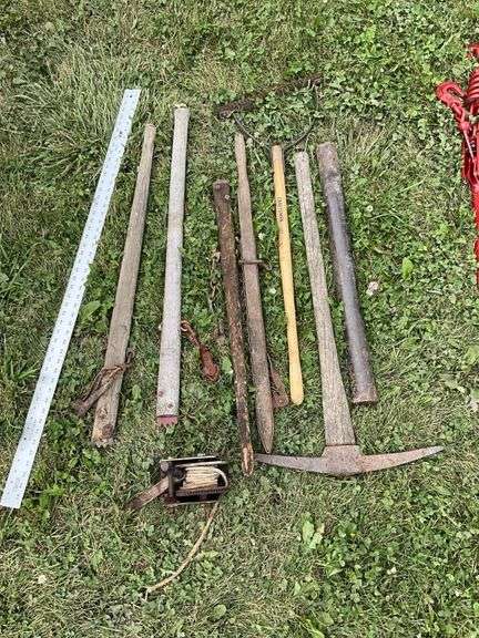 Post pounder, pickaxe, fence stretchers, winch - Legacy Auction Company