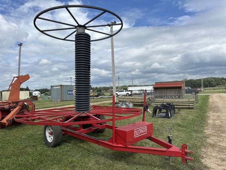 Tile stringer w/tilting hydraulics - Legacy Auction Company