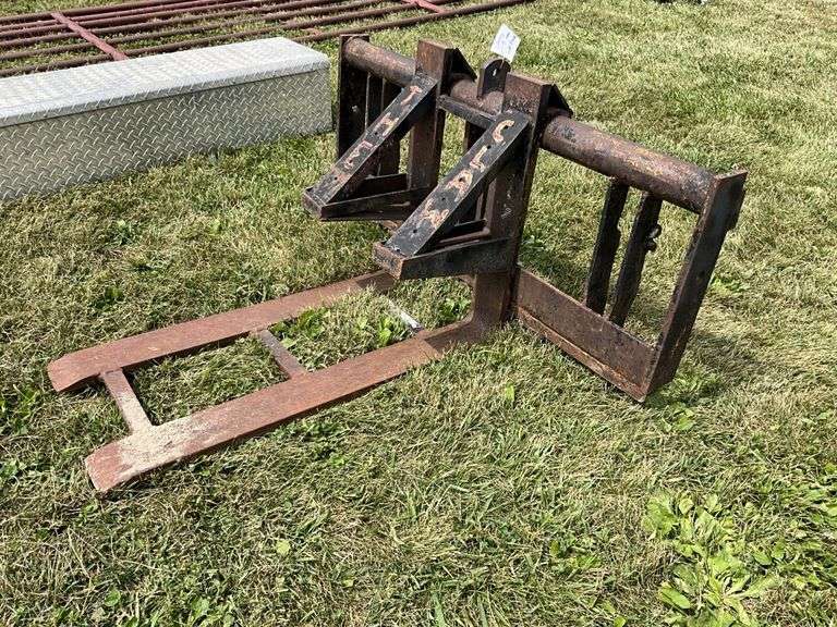Skid loader fork attachment - Legacy Auction Company