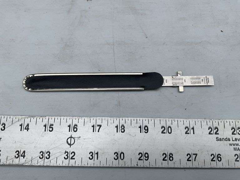 John Deere measuring device - Legacy Auction Company