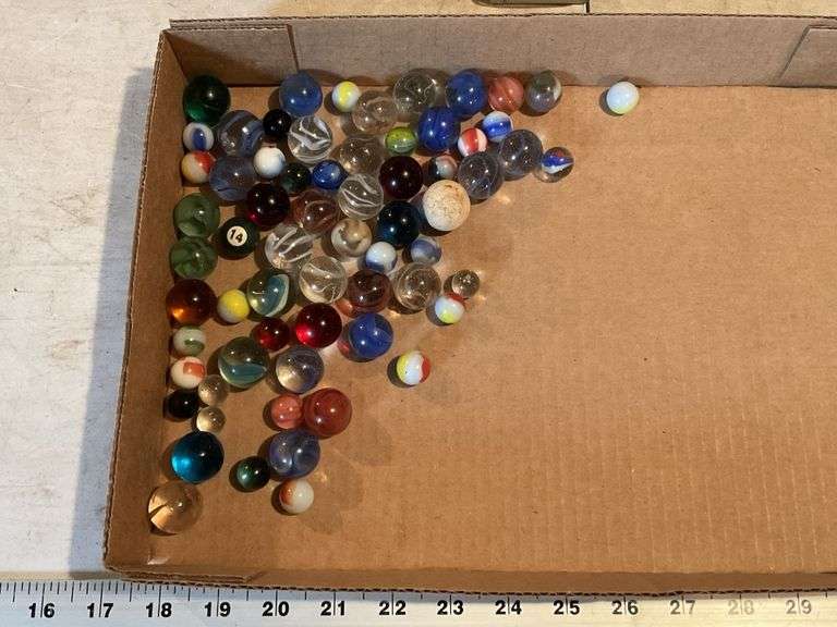 1- box of marbles - Legacy Auction Company