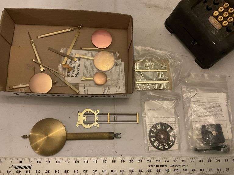 Clock parts and vintage adding machine - Legacy Auction Company