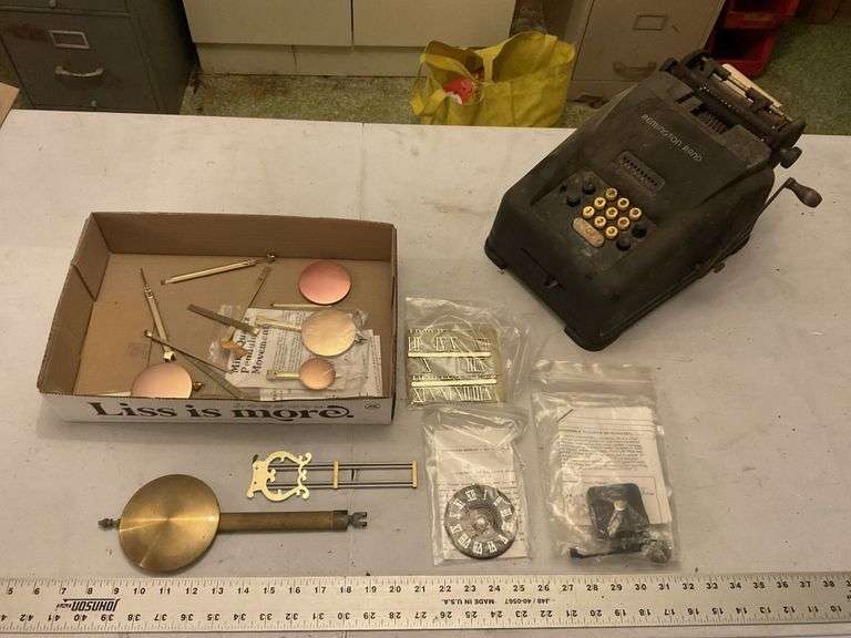 Clock parts and vintage adding machine - Legacy Auction Company