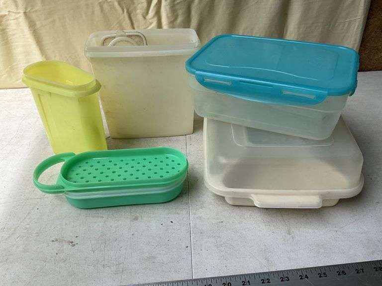 Tupperware, plastic tablecloths - Legacy Auction Company