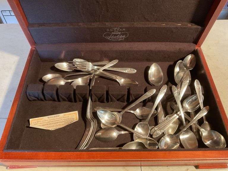 Assorted flatware in case - Legacy Auction Company
