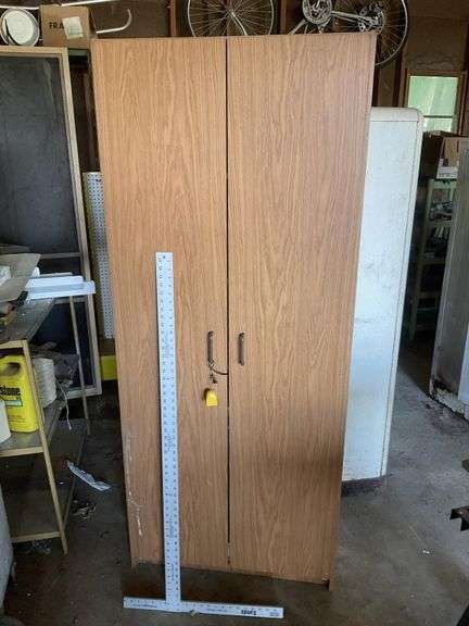 Pressboard cabinet. 30 x 17 x 6 foot tall. With - Legacy Auction Company
