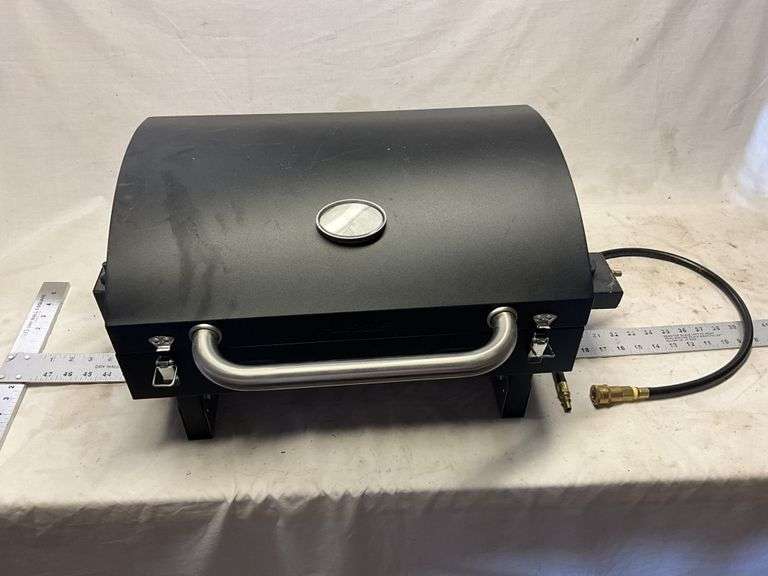 Aussie portable grill, appears new - Legacy Auction Company