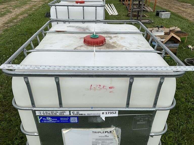Chemical tote with cagE - Legacy Auction Company
