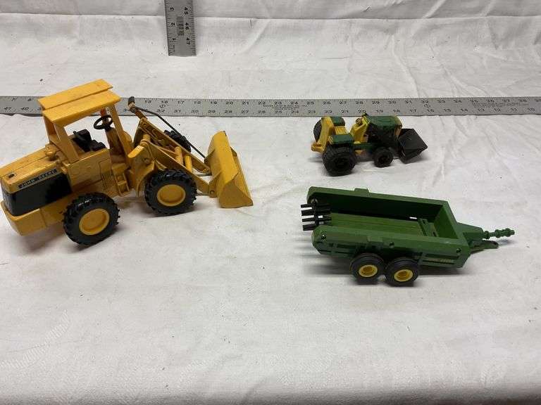 John Deere loader, John Deere manure spreader - Legacy Auction Company