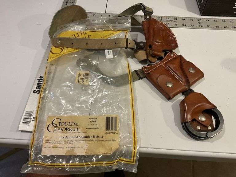 Suede lined shoulder holster with handcuffs and - Legacy Auction Company