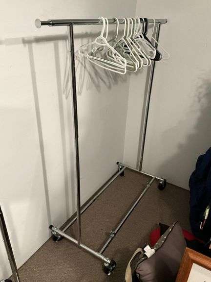 2 rolling coat racks - Legacy Auction Company