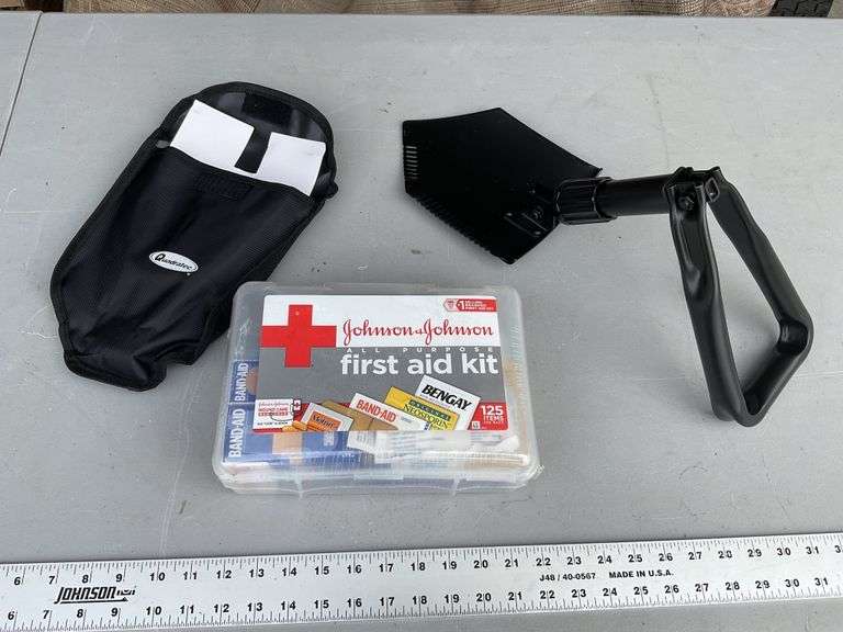 New folding shovel and first aid kit - Legacy Auction Company