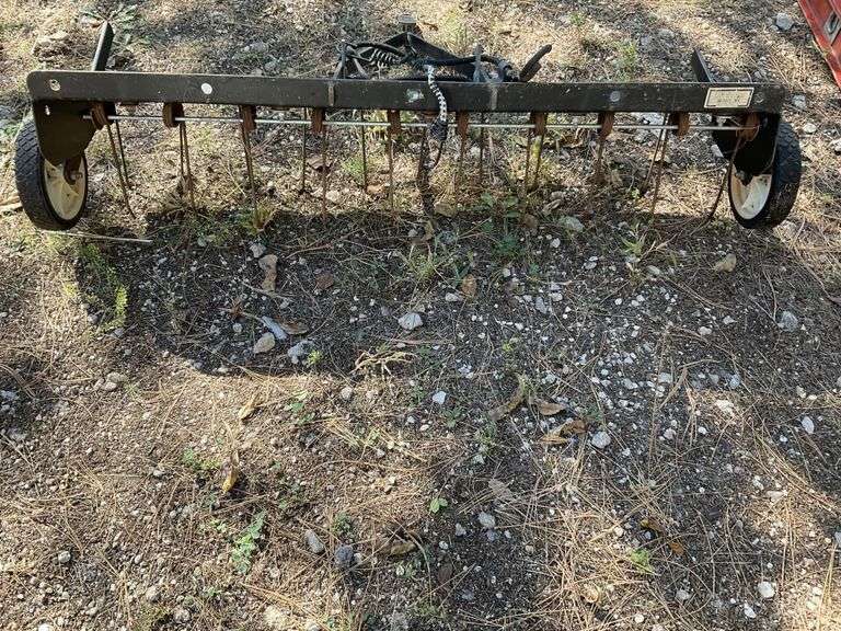 42" Craftsman pull behind thatcher - Legacy Auction Company