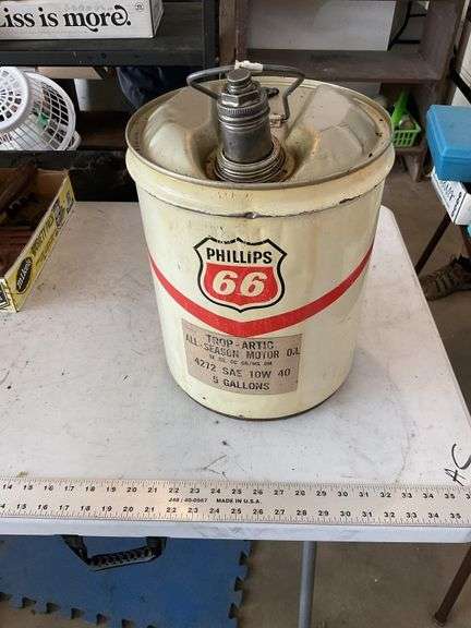 Vintage Phillips 66 fuel can with fluid - Legacy Auction Company