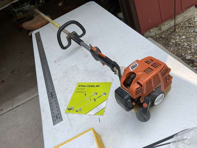 Stihl FS 85 Pro string trimmer with manual, runs - Legacy Auction Company