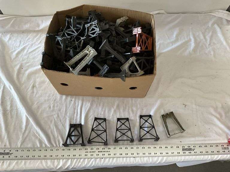 Box of raised track stands - Legacy Auction Company