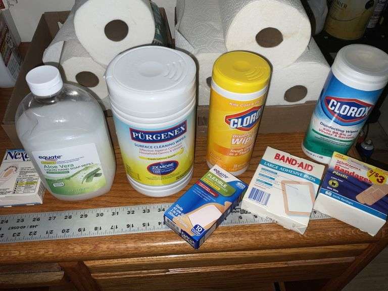 Band-Aids paper towels and cleaning supplies - Legacy Auction Company