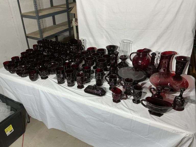 Avon Cape Cod ruby red dishes, two tables full. - Legacy Auction Company