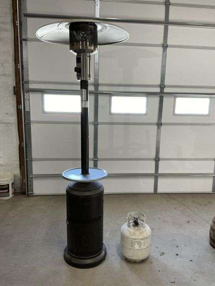 Patio heater and tank, almost full! - Legacy Auction Company