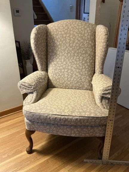 Beige wingback chair - Legacy Auction Company