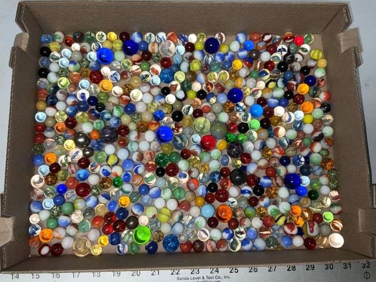 1- box of marbles - Legacy Auction Company