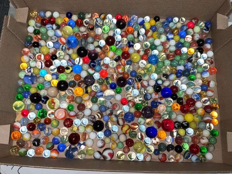1- box of marbles - Legacy Auction Company