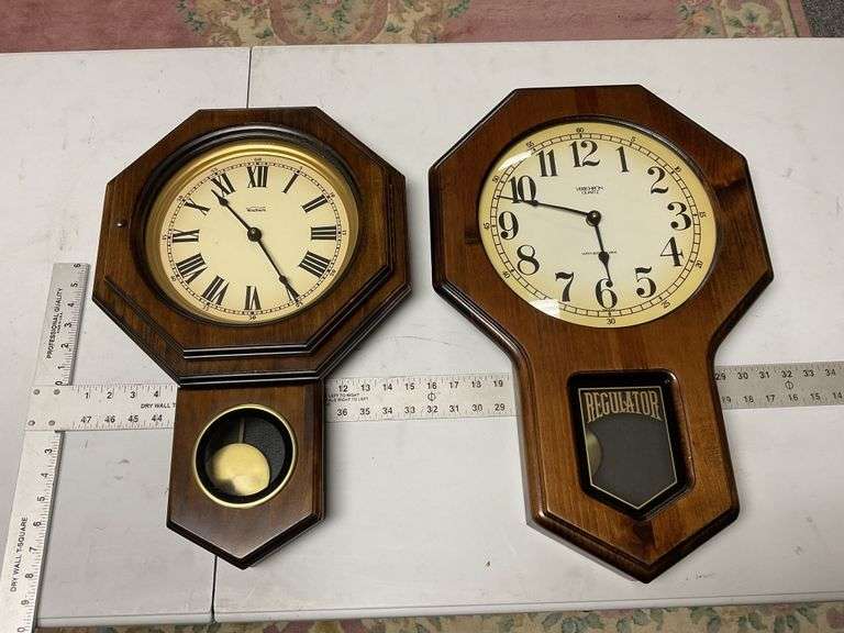 2- modern wall clocks - Legacy Auction Company